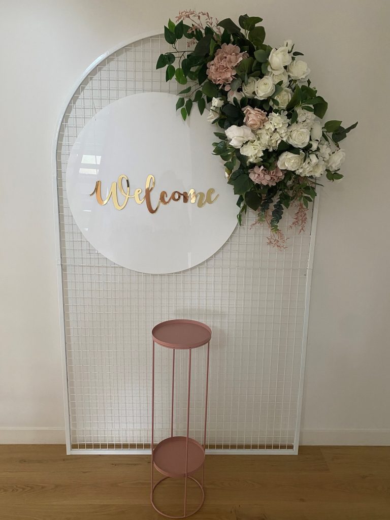 WHITE MESH ARCH BACKDROP WITH FAUX FLORALS | Styled Event Hire